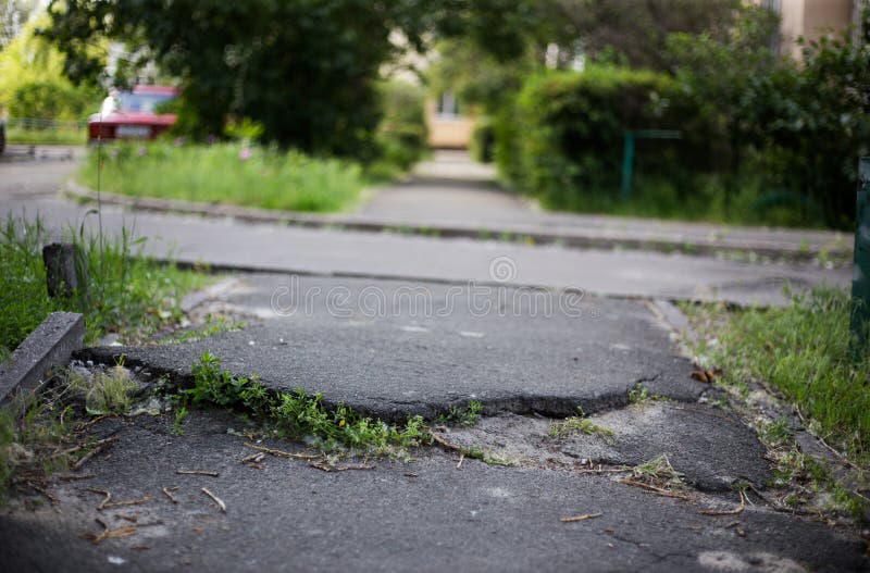 Broken Asphalt and Cracks on the Road Surface Stock Photo - Image of ...
