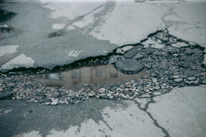 Broken Asphalt and Cracks on the Road Surface Stock Image - Image of ...
