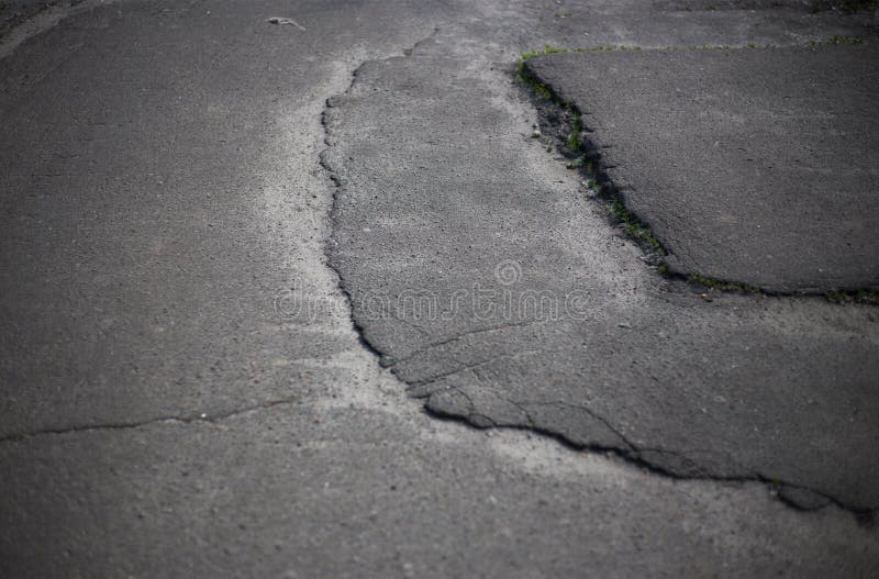 Broken Asphalt and Cracks on the Road Surface Stock Image - Image of ...