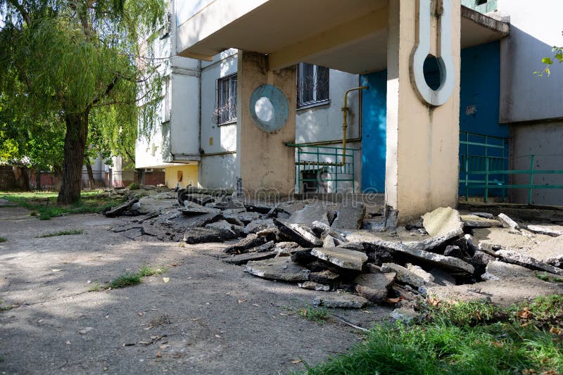 Broken Asphalt Pavement. Broken Blind Area of an Apartment Building ...
