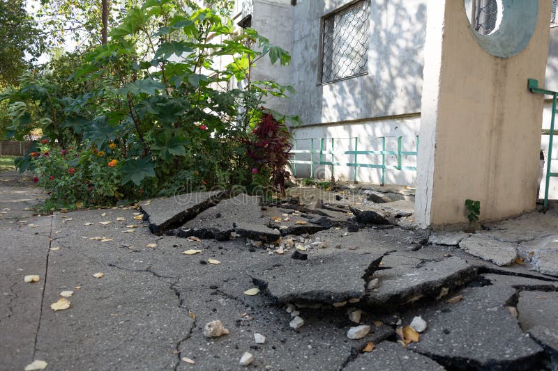 Broken Asphalt Pavement. Broken Blind Area of an Apartment Building ...