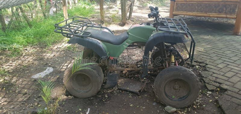 A Broken Atv Motor Left Unkempt in the Yard Stock Photo - Image of ...