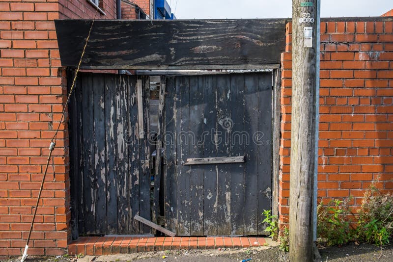 A Broken Back Gate Protecting a Property Stock Image - Image of home ...