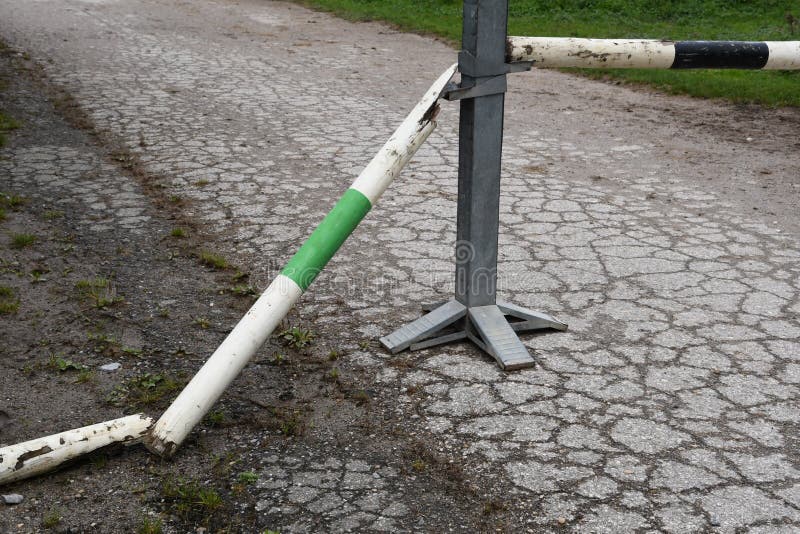 Broken Barrier Closing a Road Stock Image - Image of green, beam: 199450449