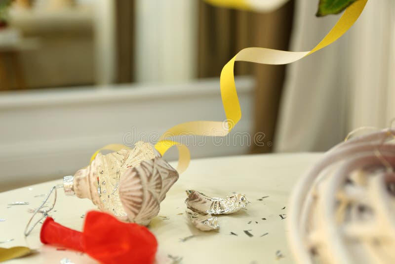 Broken Bauble on White Table. Mess after New Year Party Stock Image ...