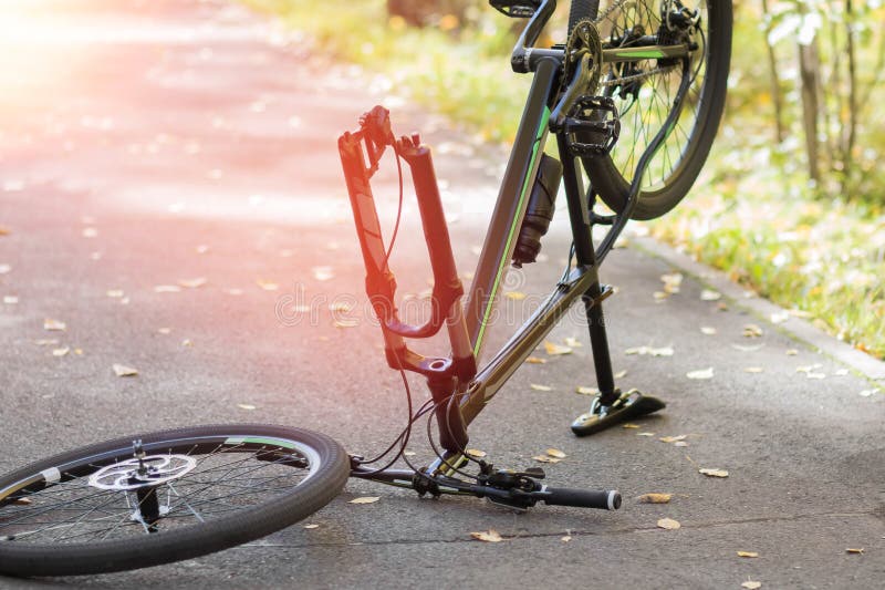 A Broken Bicycle in the Park. Close Up Stock Photo - Image of ground ...