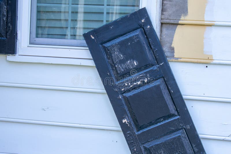 A Broken Outdoor Window Shutter Hanging on the Wall Stock Photo - Image ...