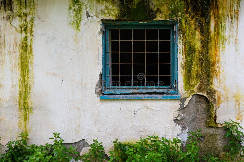Broken Blue Window with Metal Frame on a Damaged White Wall Stock Image ...