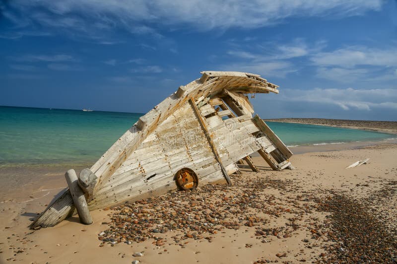 A Broken Boat Thrown Out on a Deserted Beach Stock Image - Image of ...