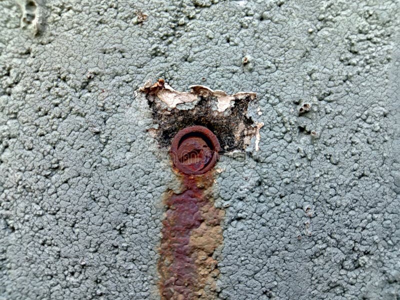 A Broken Bolt Has Been Stuck in the Concrete Wall for a Long Time and ...