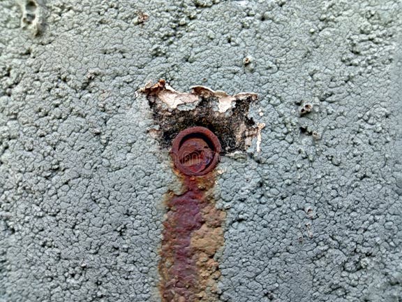 A Broken Bolt Has Been Stuck in the Concrete Wall for a Long Time and ...