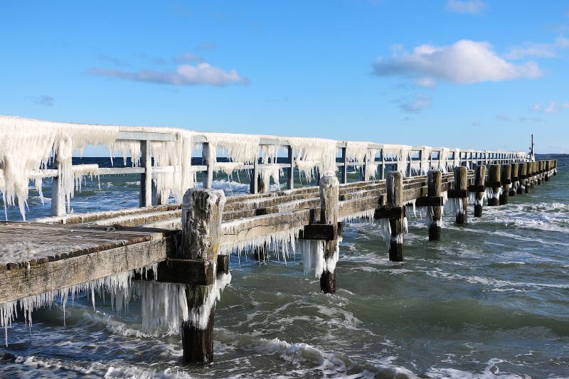 A Broken Bridge into the Sea in Winter and the Railing is Completely ...