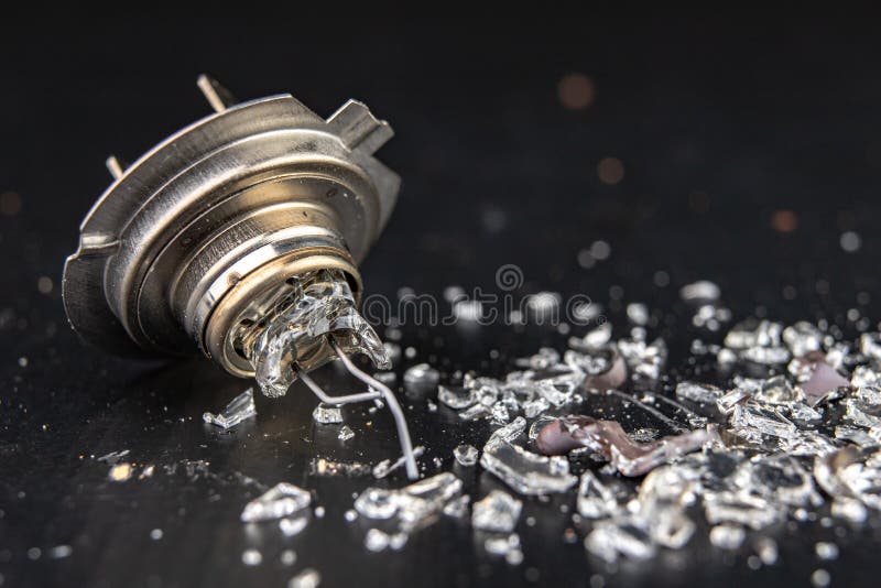 Broken Bulb for the Car Headlight. Spilled Glass and Broken Filament on ...