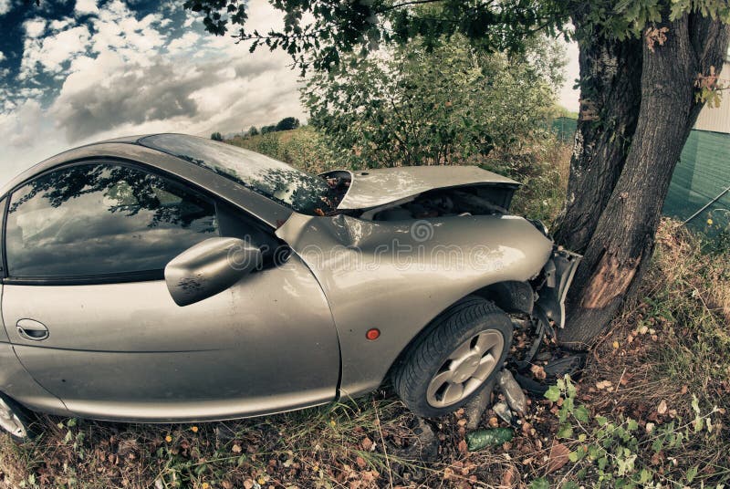 Broken Car after an Accident Against a Tree Stock Photo - Image of ...