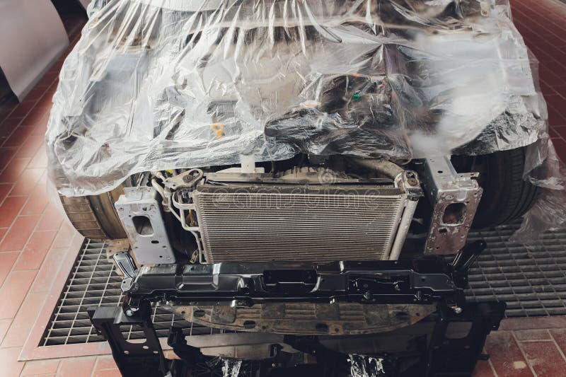 A Broken Car Color Silver, Wrapped in a Plastic Coating. the Car is ...