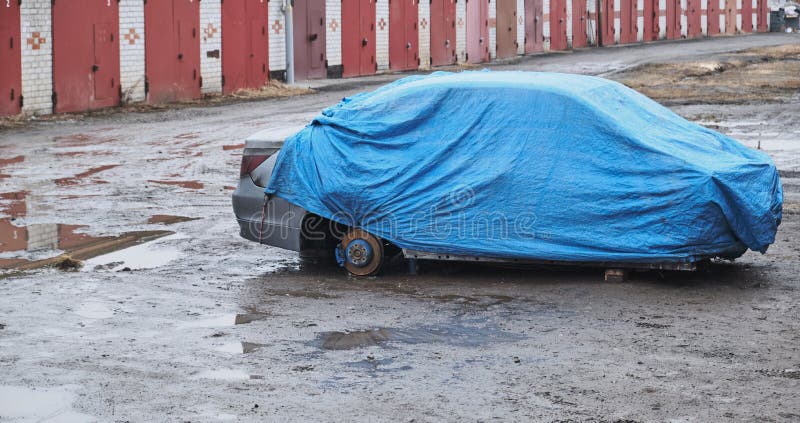 Broken car covered stock photo. Image of deformation - 215696724