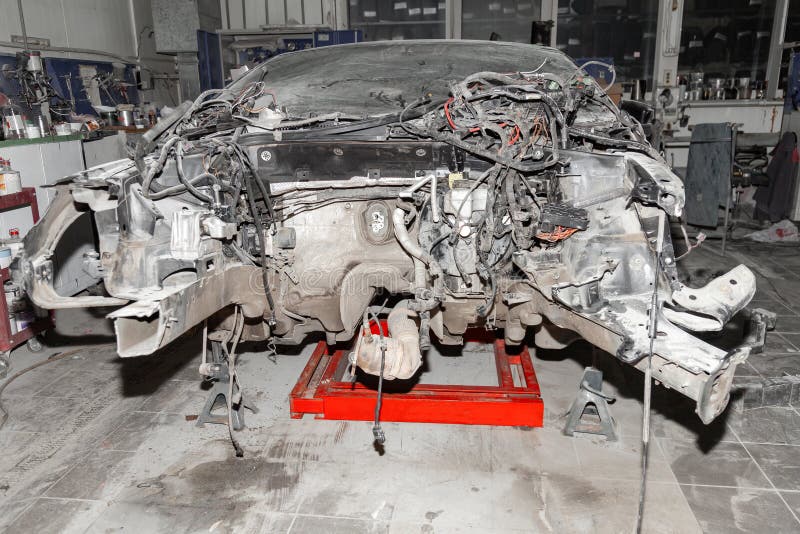 A Broken Car with a Violation of Geometry is on the Stocks for Leveling ...