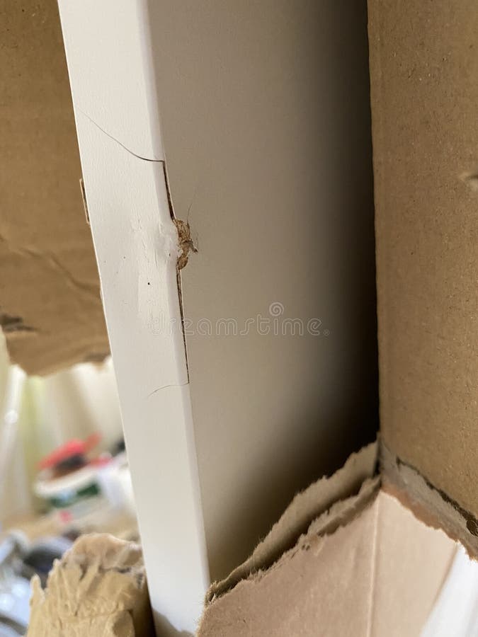A Broken Cardboard Piece Sits on a Stack of Cardboard Boxes Stock Image ...