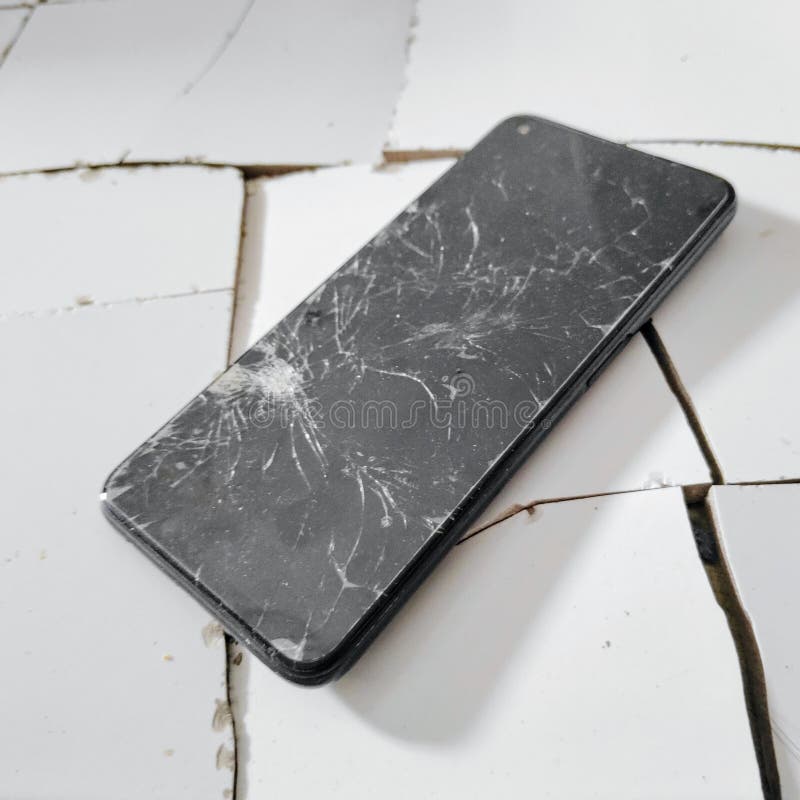 Broken Cell Phone on Table stock image. Image of gadget - 315821955
