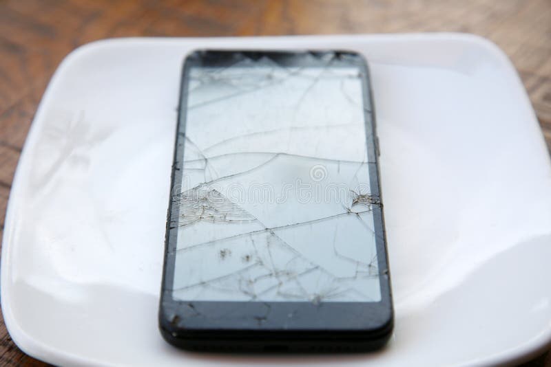 Broken Cellular Telephone. a Cellular Telephone with a Cracked and ...