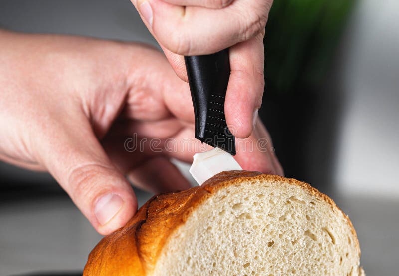 Broken Ceramic Knife while Cutting a Loaf in the Kitchen. Poor Quality ...