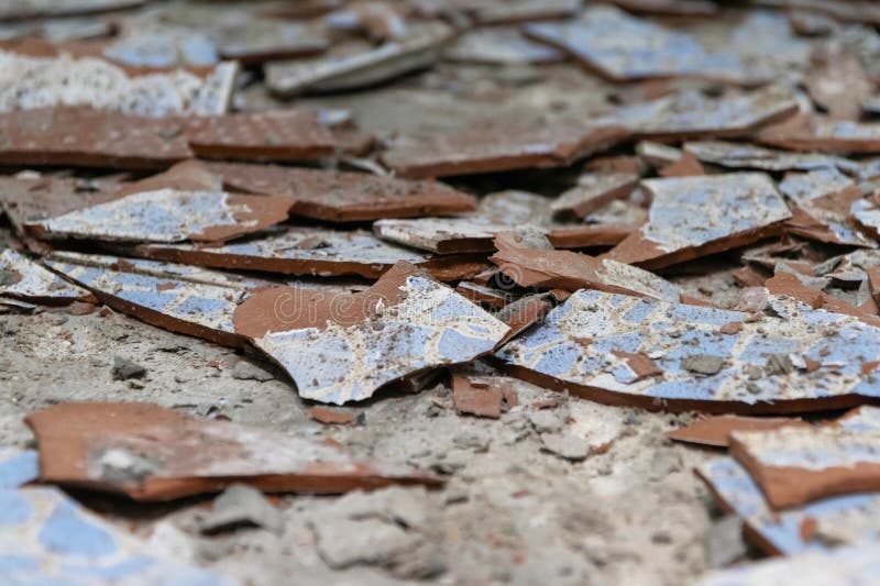 Broken Ceramic Pieces Scattered on the Ground, Showcasing Texture and ...