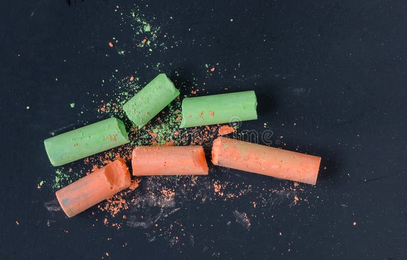 Broken Chalk On Teacher's Desk In Front Of Blackboard Stock Photo ...