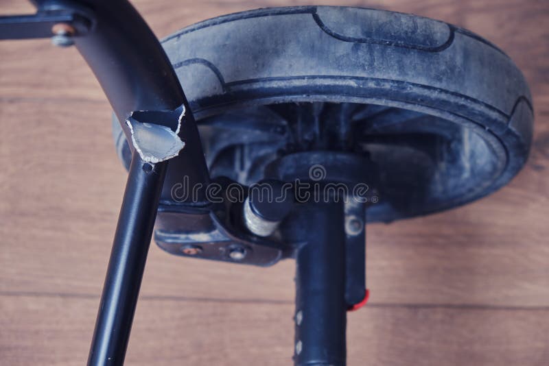 Broken Chassis of a Baby Stroller, Damage To the Crossbar of the Metal ...