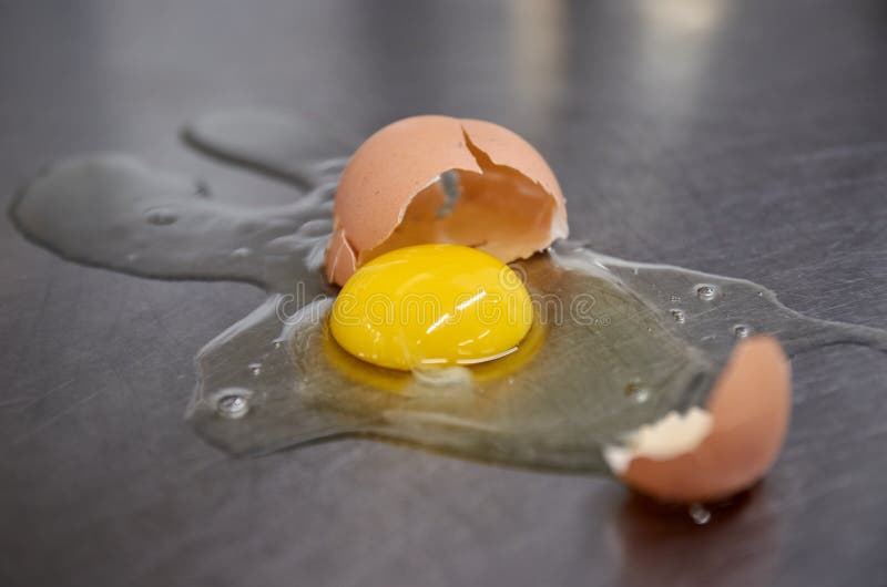 Broken Chicken Egg on the Iron Table Close-up. Horizontal View. a Raw ... Broken Chicken Egg on the Iron Table Close-up. Horizontal View. a Raw ...