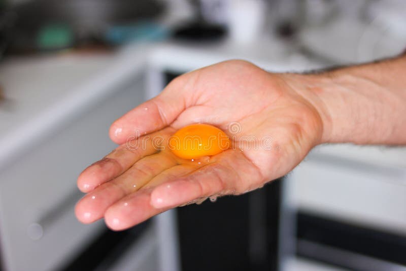 Broken Chiken Raw Egg without Shell in a Man`s Hand. Close-up View ...
