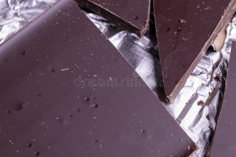 A Broken Chocolate Bar in a Paper and Foil Package Stock Image - Image ...
