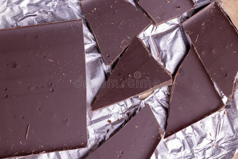 A Broken Chocolate Bar in a Paper and Foil Package Stock Photo - Image ...