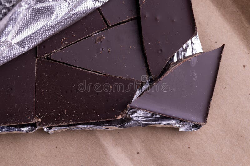 A Broken Chocolate Bar in a Paper and Foil Package Stock Photo - Image ...