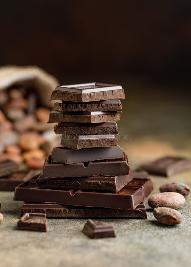 Broken Chocolate Pieces on Dark Background. Stack of Dark Chocolate ...