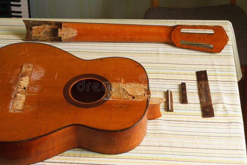 Broken Classical Guitar on a Table Stock Image - Image of strings ...