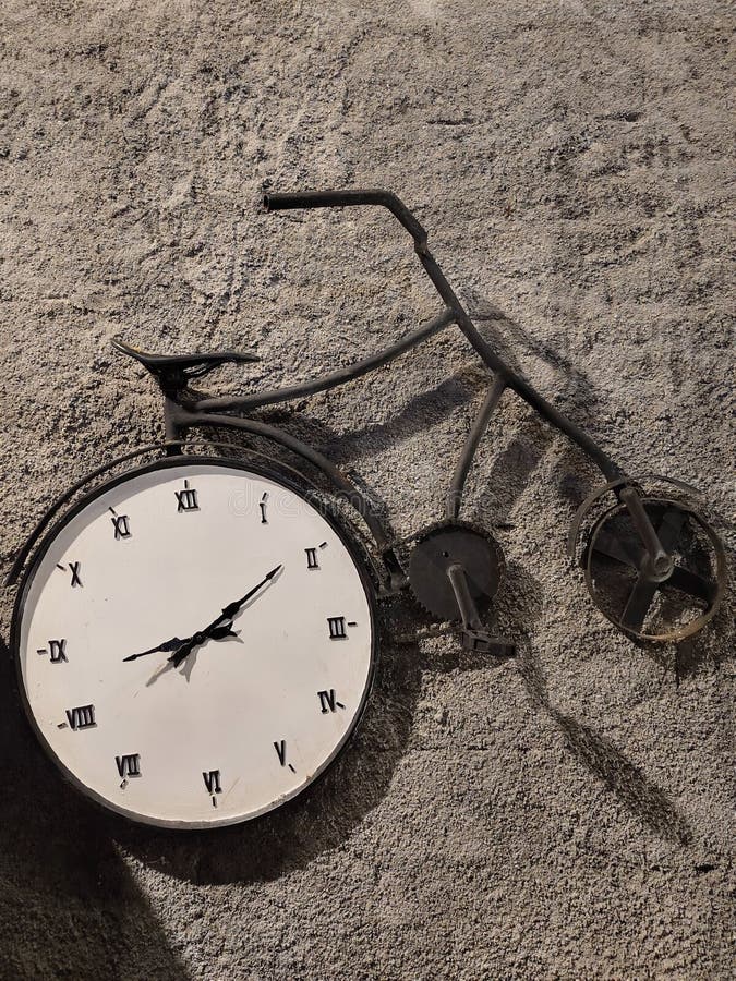 A Broken Clock in the Shape of an Old Bicycle Stock Photo - Image of ...