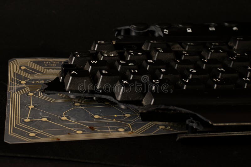 A Broken Computer Keyboard Isolated on Black Stock Photo - Image of ...