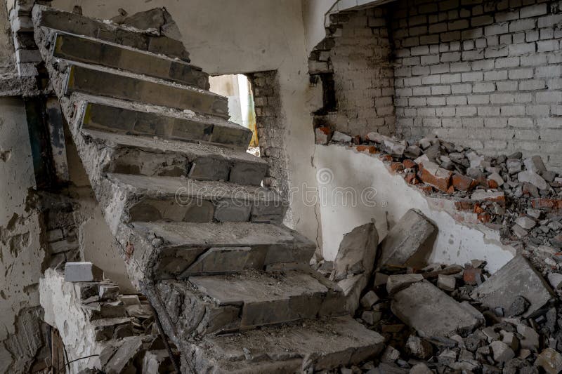 A Broken Concrete Staircase with a Pile of Broken Bricks and ...