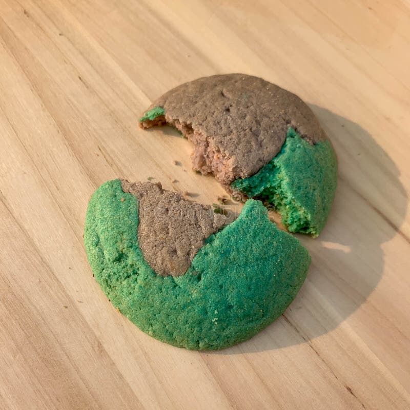 Broken Cookie with Green Topping on Wooden Surface Highlighting ...