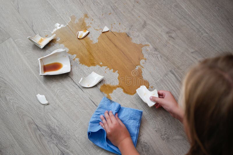 A Broken Cup of Coffee Fell on Laminate, Coffee Spilled on Floor Stock ...