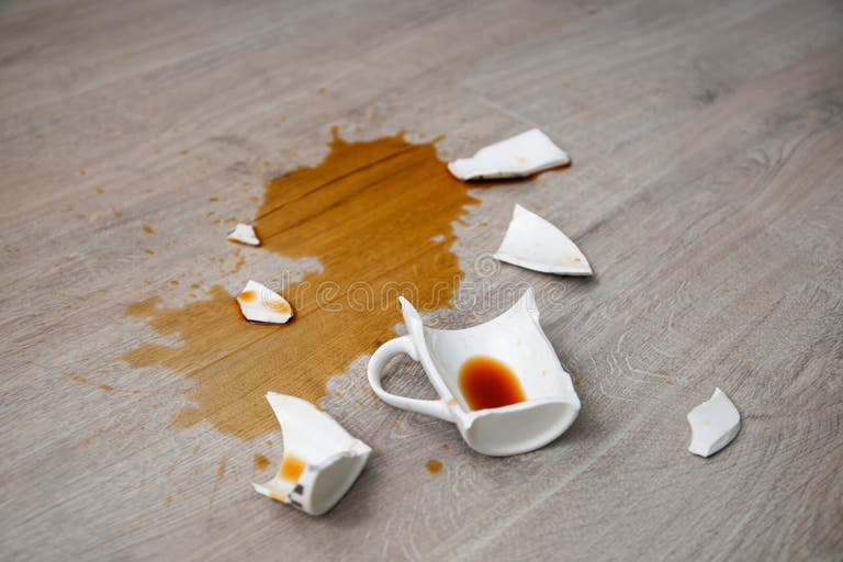 A Broken Cup of Coffee Fell on Laminate, Coffee Spilled on Floor Stock ...