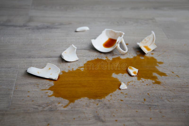 A Broken Cup of Coffee Fell on Laminate, Coffee Spilled on Floor Stock ...