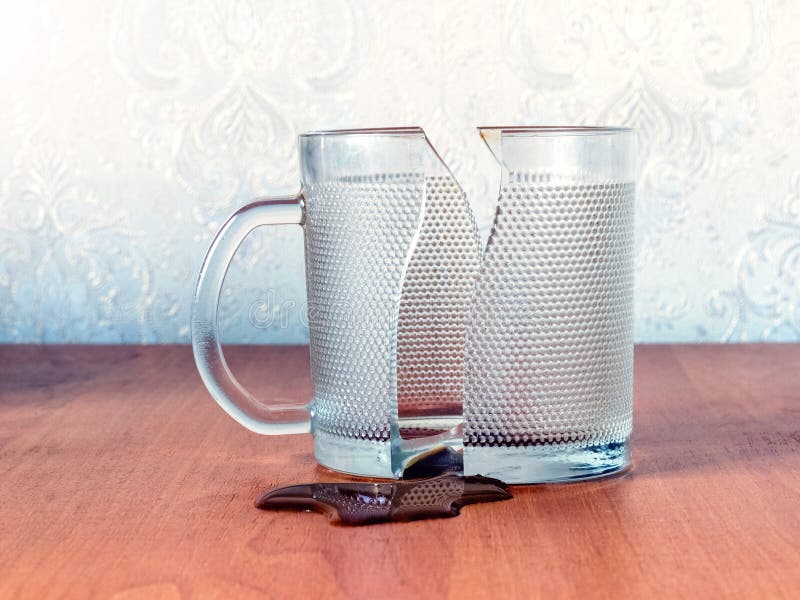 Broken Cup and Spilled Coffee or Tea in the Office on the Table Stock ...