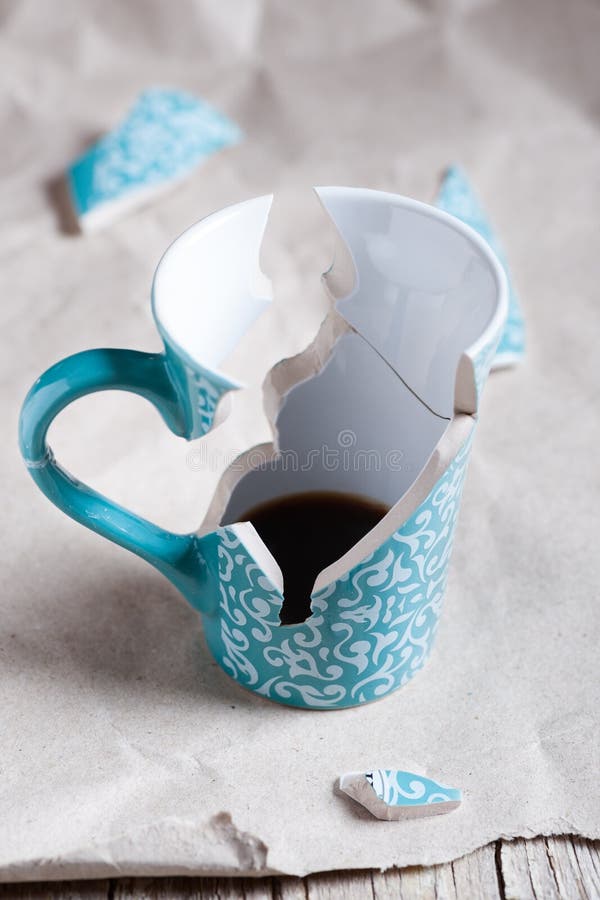 Broken Cup and Stuck Back on Wooden Table Stock Image - Image of ...