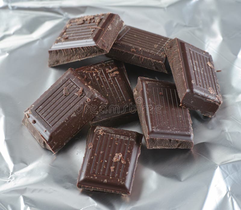 Broken Dark Chocolate Pieces in Silver Foil Stock Photo - Image of food ...