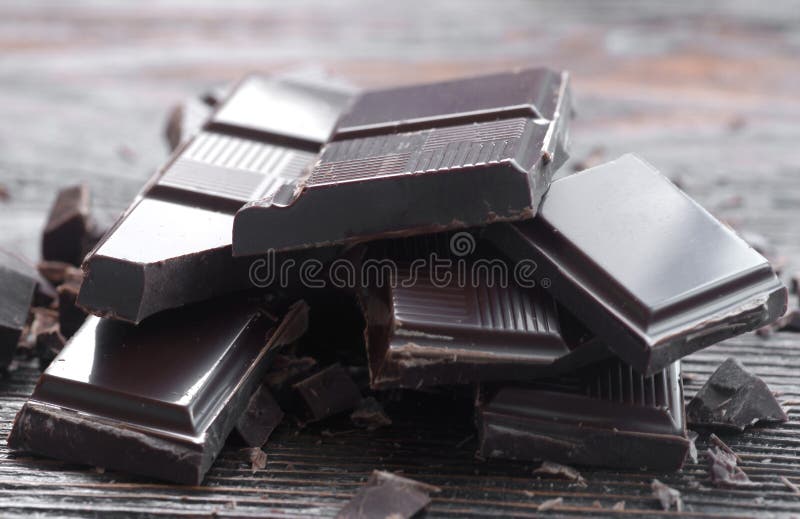 Broken Dark Chocolate on a Wooden Table Stock Photo - Image of cracked ...