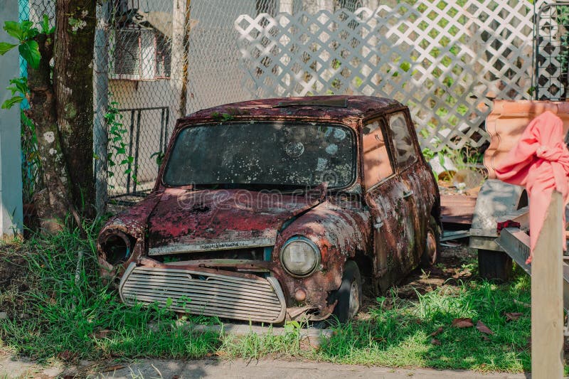 Broken and Decaying Small or Micro Car from the Seventies is Rotting on ...