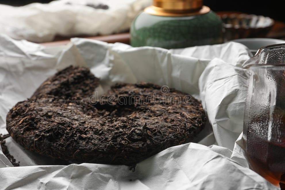 Broken Disc Shaped Pu-erh Tea on Parchment Paper Stock Image - Image of ...
