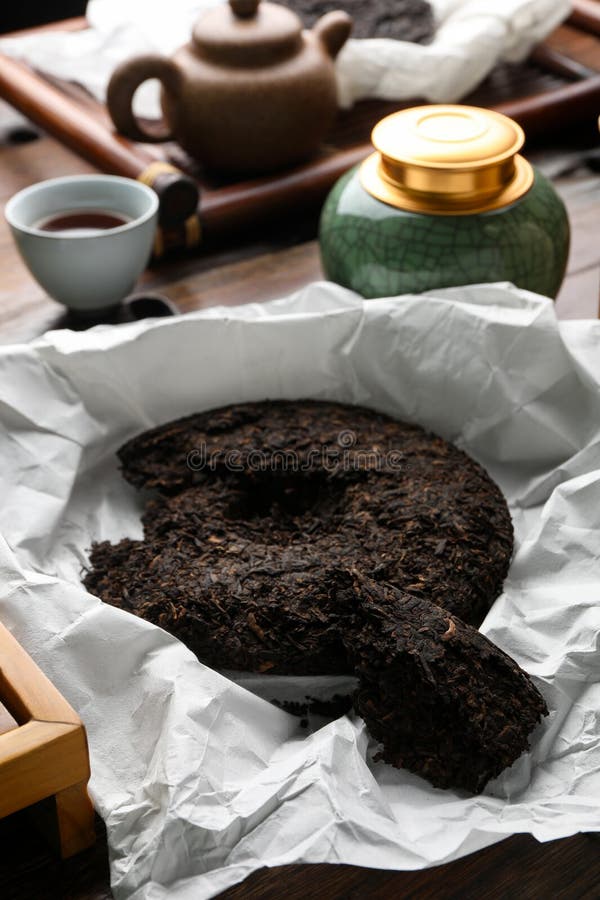 Broken Disc Shaped Pu-erh Tea on Table Stock Image - Image of fermented ...