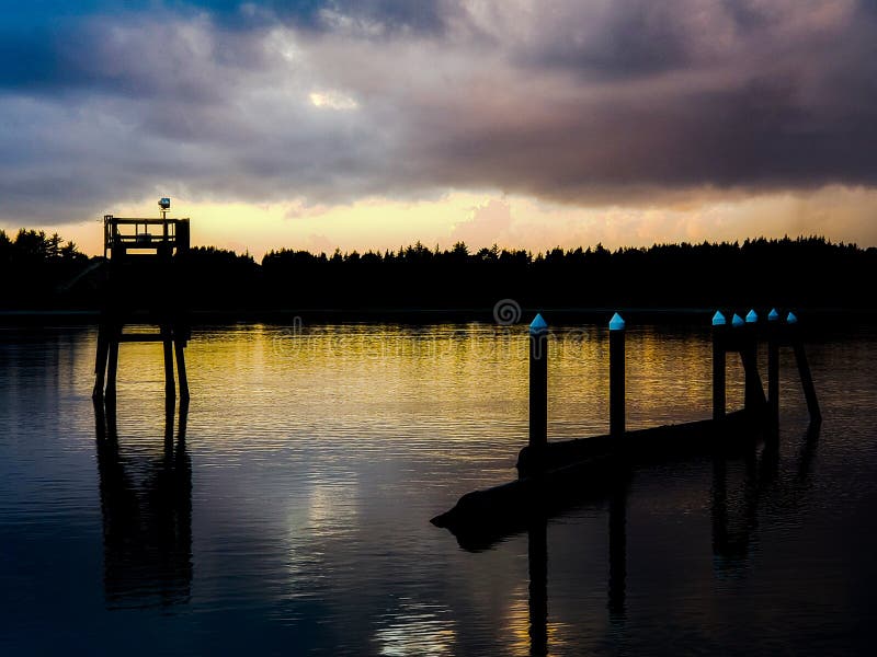 Broken dock at the bay. stock photo. Image of horizon - 274085016